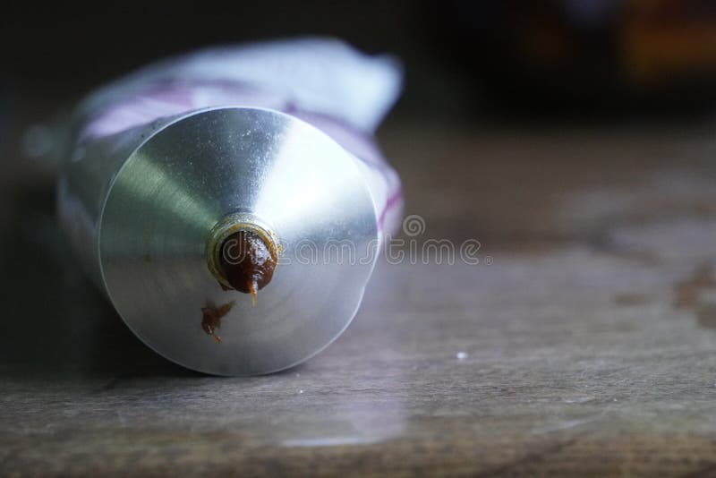 Closeup Shot of the Dark Toothpaste Inside the Tube Stock Image - Image ...