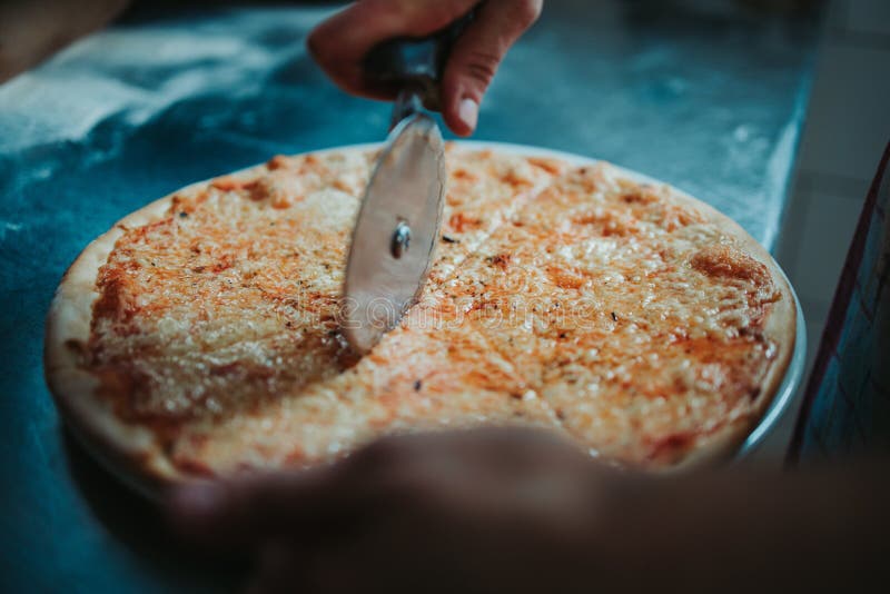 Closeup Shot of a Delicious Pizza Getting Cut Stock Image - Image of ...