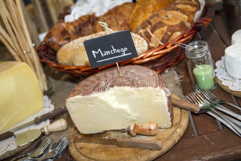 Closeup Shot of Different Kinds of Cheese and Bread on a Table in a ...