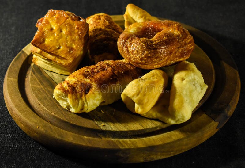 Closeup Shot of Different Types of Pastry on a Round Wooden Board Stock ...