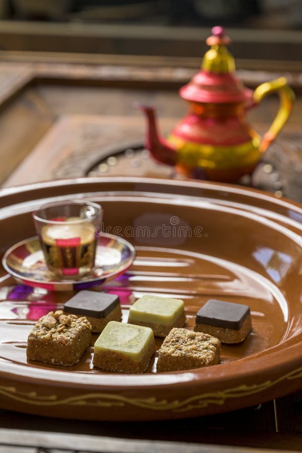 Closeup Shot of Different Types of Square-shaped Sweets with Tea on a ...
