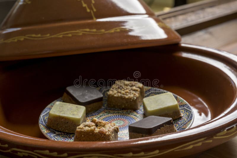 Closeup Shot of Different Types of Square-shaped Sweets in a Wooden ...