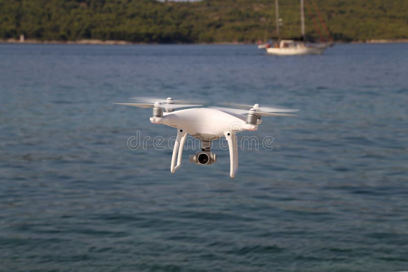 Closeup Shot of a Drone Flying Over Water Stock Photo - Image of ...