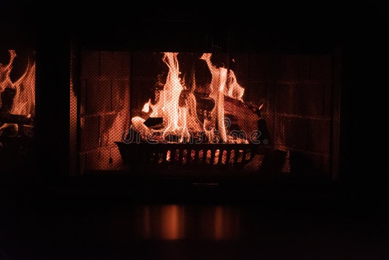 Closeup Shot of a Fire in a Brick Fireplace with Screen Stock Photo ...