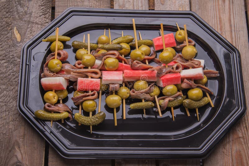 Closeup Shot of Fish Marinated Cucumber Olives and Crabs on Sticks ...