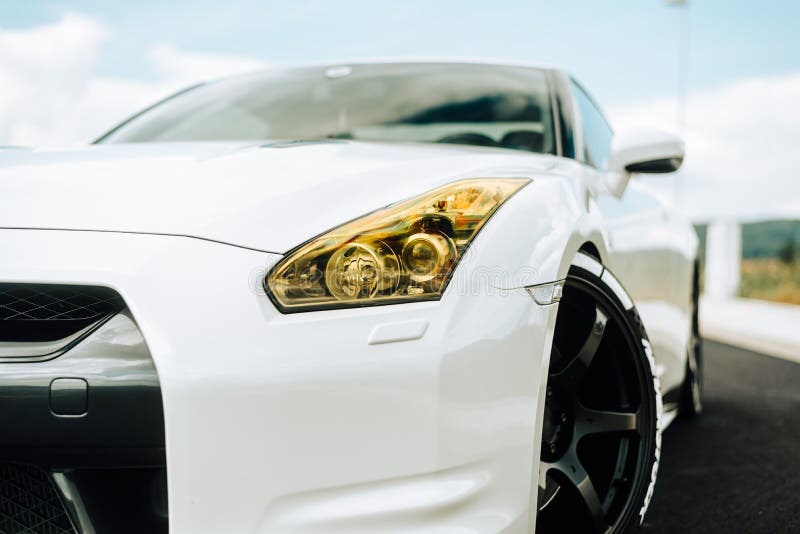 Closeup Shot of the Front and the Headlight of White Nissan Gtr in ...