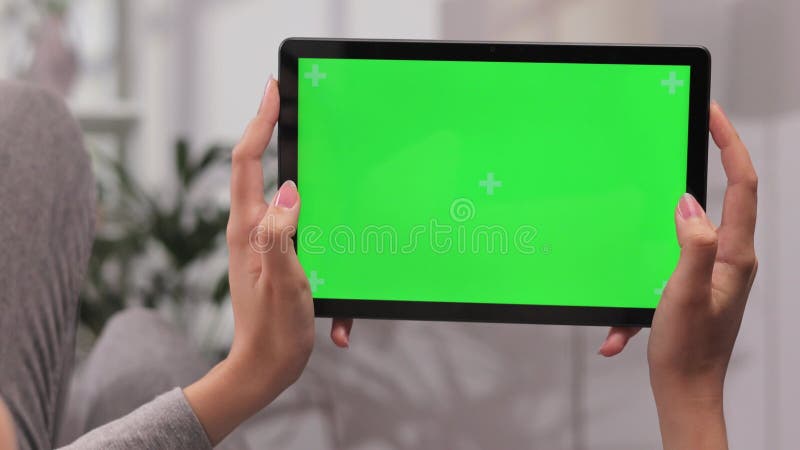Closeup Shot of Girl Lying on Sofa Using Tablet in Horizontal Position ...