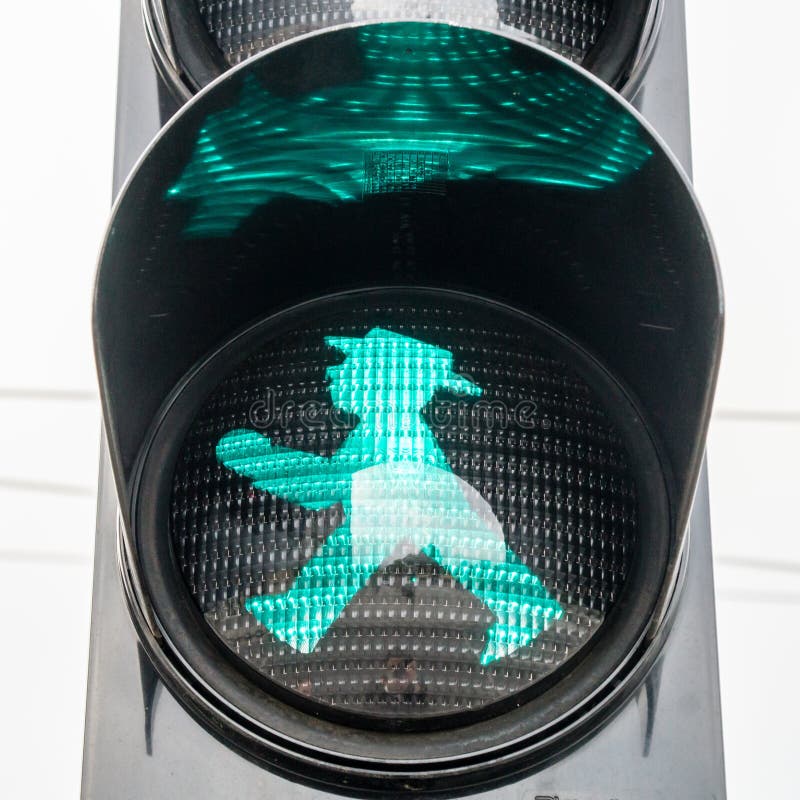 Closeup Shot of a Green Traffic Light with a Human Figure Stock Image ...