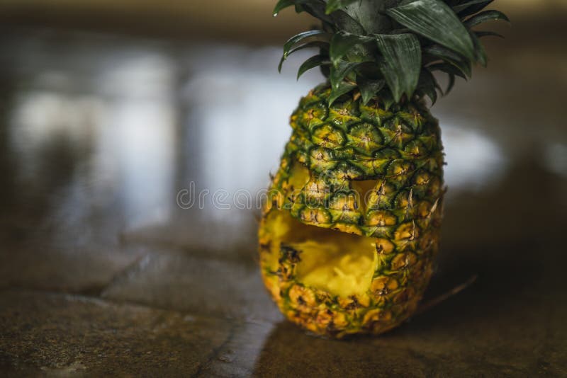 Halloween Pineapple with a Scary Face in a Mud Stock Photo - Image of ...