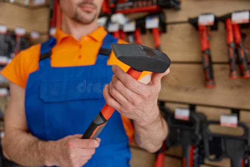 Closeup Shot of Hammer in Salesman Hands Over Multiple Metallic Tools ...