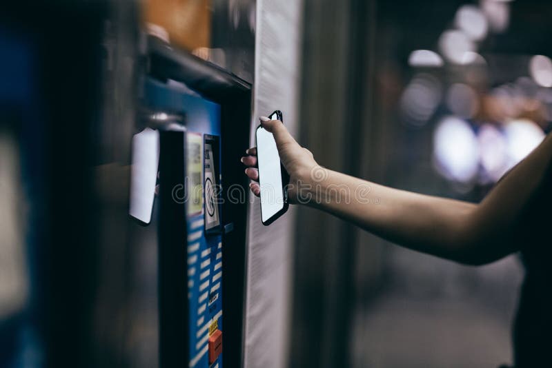 Closeup Shot of a Hand with a Cell Phone Scanning a QR Code To Check in ...