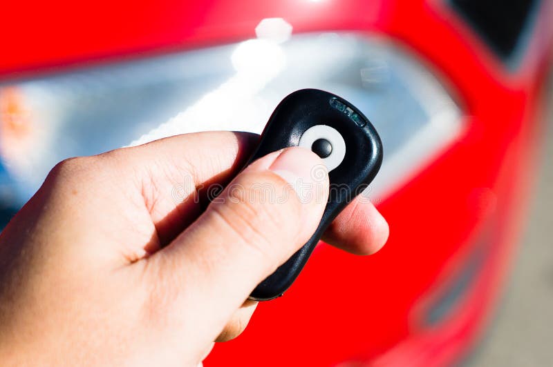 Closeup Shot of a Hand Locking a Car with a Remote Key Stock Image ...