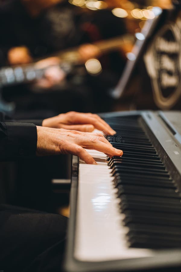 Closeup Shot of the Hands of a Pianist on a Piano. Stock Image - Image ...