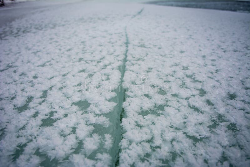 Closeup Shot of an Icy Surface Adorned with Snow Patterns Stock Image ...