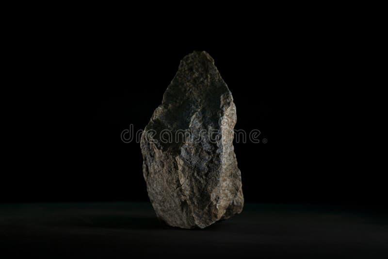 Closeup Shot of an Igneous Rock Isolated on a Black Background Stock ...