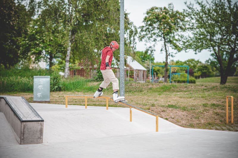 Closeup Shot of an Inline Skater in a Skating Rink Practicing Moves ...