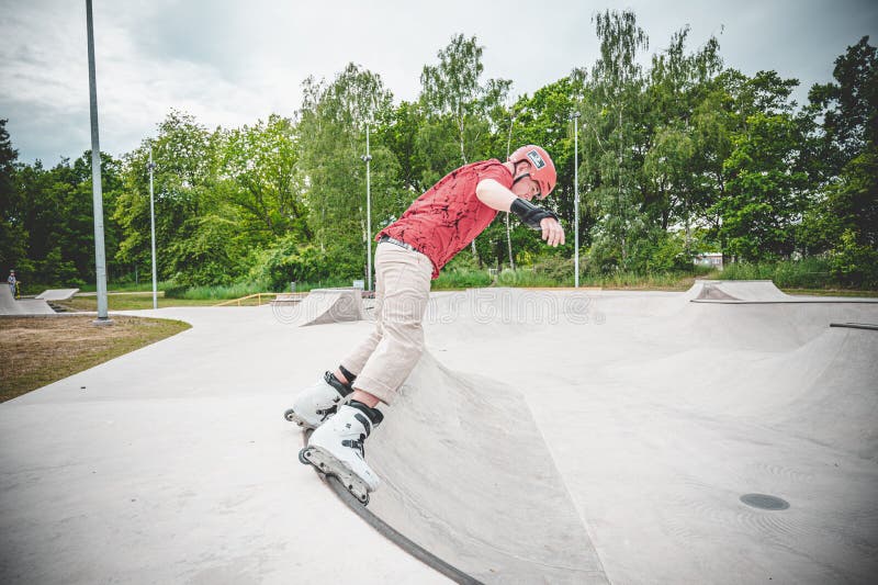 Closeup Shot of an Inline Skater in a Skating Rink Practicing Moves ...