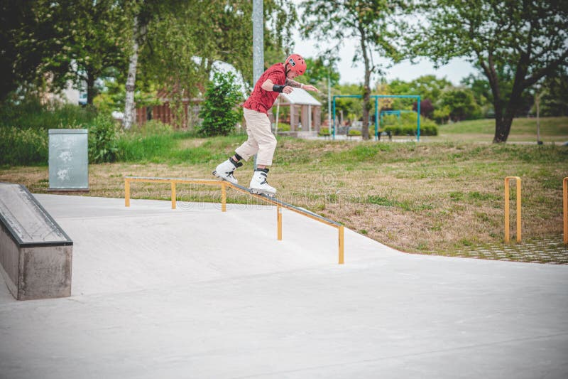 Closeup Shot of an Inline Skater in a Skating Rink Practicing Moves ...