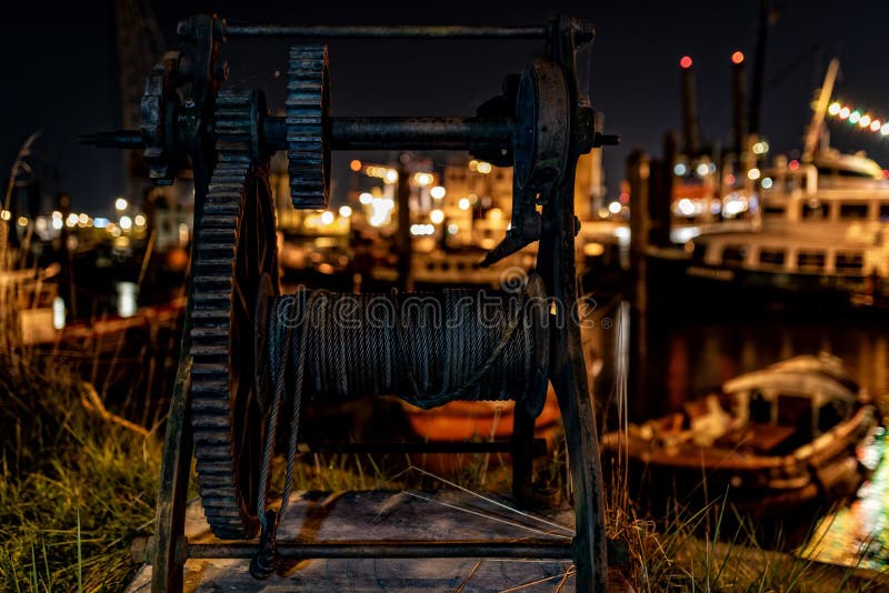 Closeup Shot Of A Lifting Mechanism Cable With Bokeh Lights In The ...