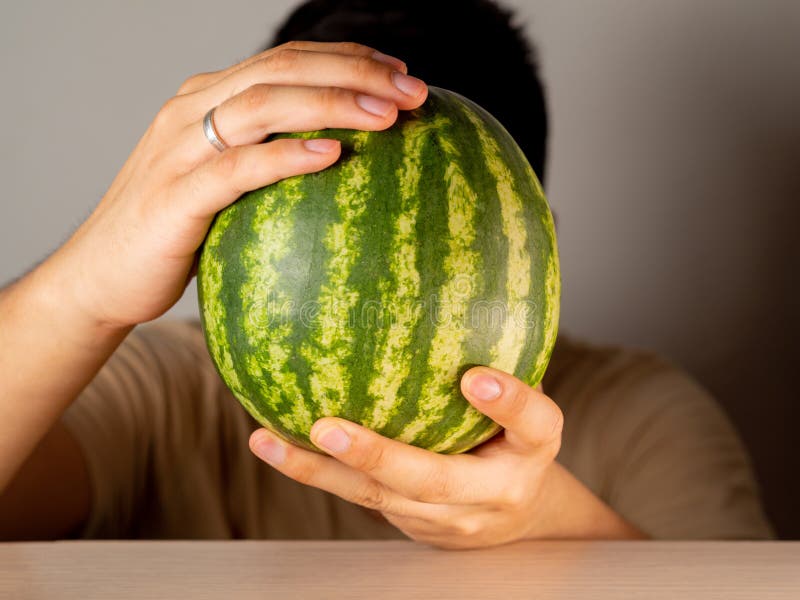 Closeup Shot of Male Hands Holding a Watermelon Stock Image - Image of ...