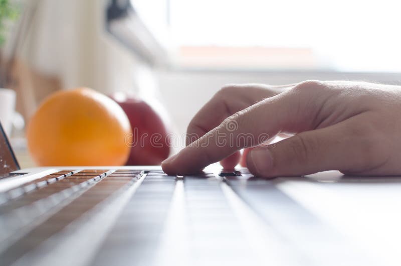 Closeup Shot of the Male Hands Typing on Laptop on Blurred Background ...