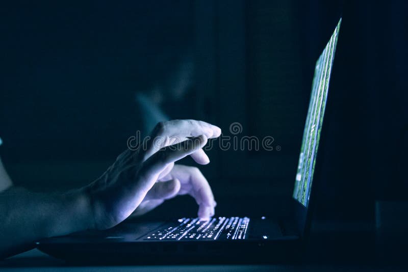 Closeup Shot of a Male Working on His Computer in a Dark Room Stock ...