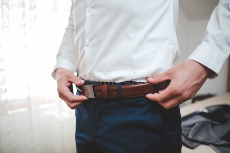 Closeup Shot of a Man Adjusting His Belt Stock Photo - Image of clothes ...