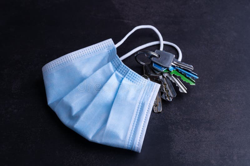 Closeup Shot of a Medical Face Mask and Keys on a Black Surface Stock ...