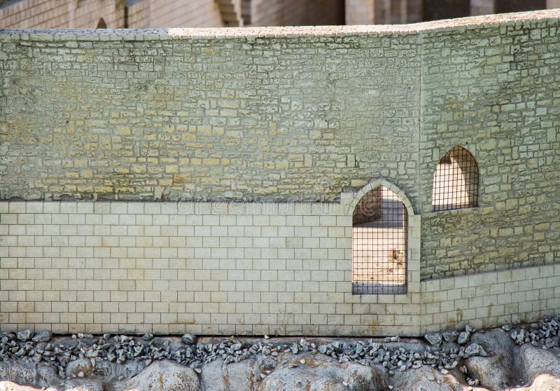 Closeup Shot of a Miniature Wall with Arched Windows Stock Photo ...