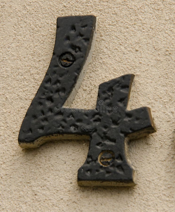 Closeup Shot of Number 4 on a Beige Wall Stock Image - Image of four ...