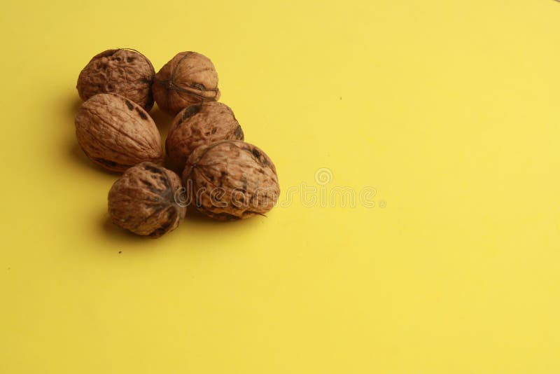 Closeup Shot of Nuts on a Yellow Surface Stock Image - Image of organic ...