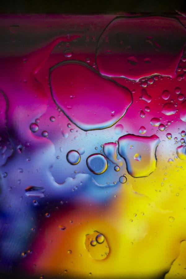 Closeup Shot of Oil Drops on a Water Surface with Colorful Textures ...