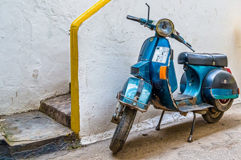 Closeup Shot of an Old Blue Moped in Front of the White Wall Editorial ...