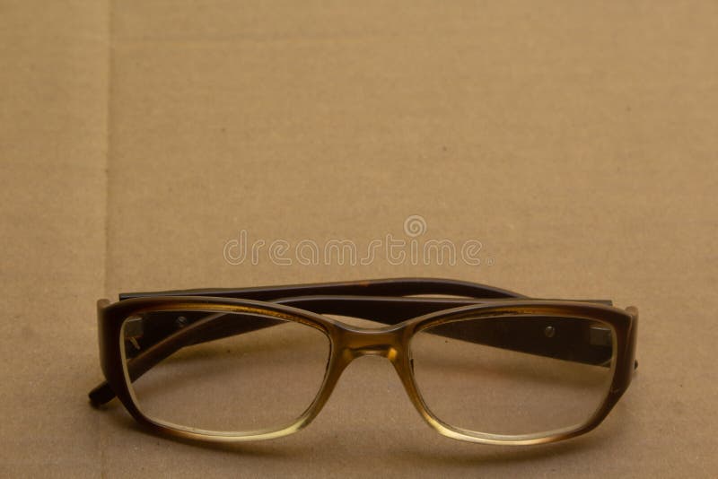 Closeup Shot of Old Style Eyeglasses on a Cardboard Surface Stock Image ...