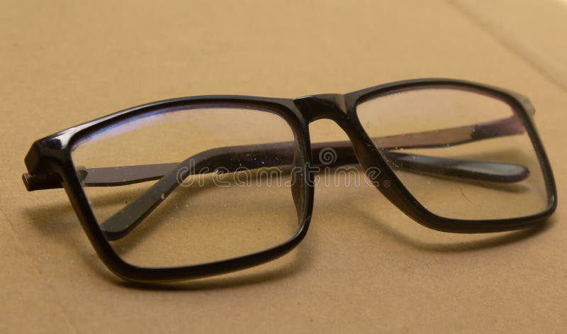 Closeup Shot of Old Style Eyeglasses on a Cardboard Surface Stock Photo ...