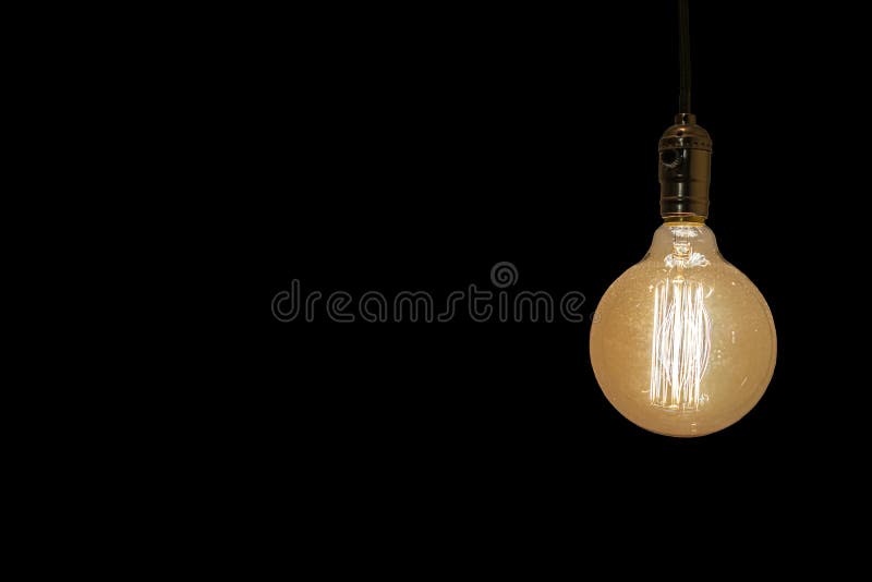 Closeup Shot of an Old Yellow Lightbulb on Black Background Stock Image ...
