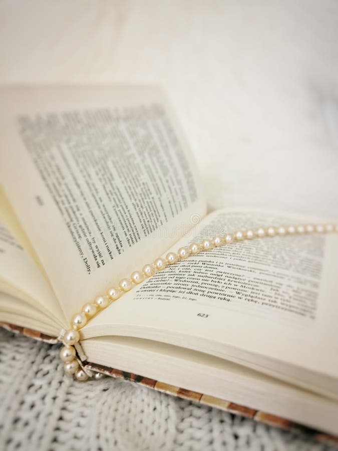 Closeup Shot of an Open Book with White Pearl Beads Stock Photo - Image ...
