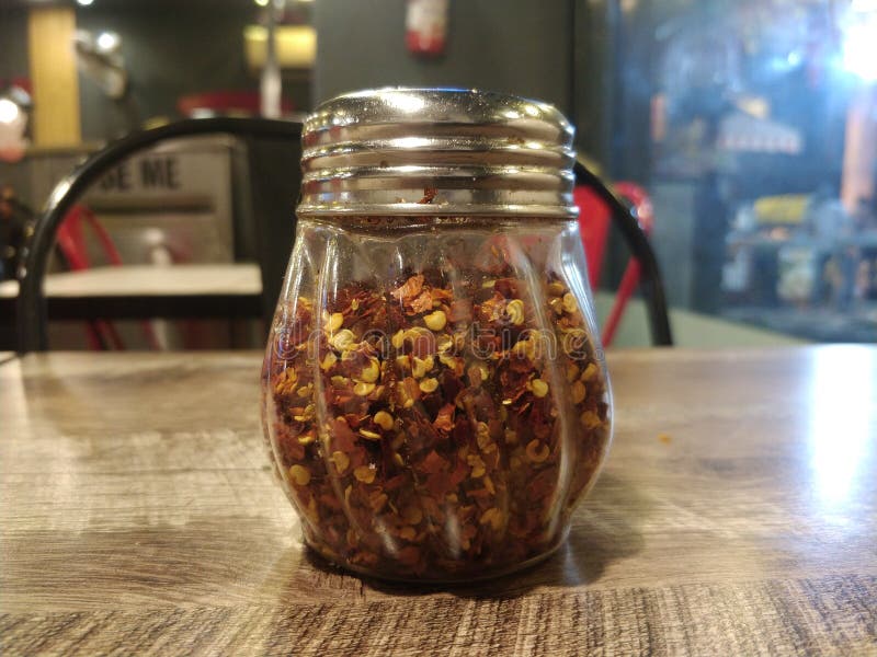Closeup of Oregano Spice Leaves Pored into a Container Stock Photo ...