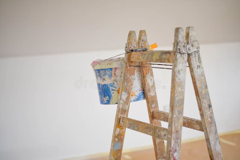 Closeup Shot of a Paint Bucket Hanging on a Ladder Stock Image - Image ...
