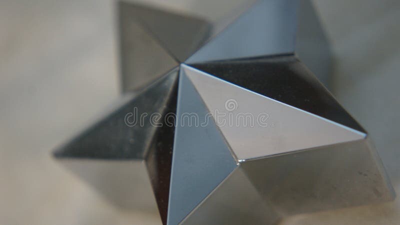 Closeup Shot of a Piece of Metal Shaped Like a Star on a Table Stock ...