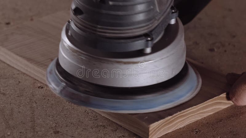 Closeup Shot of the Process of Sanding Oak Wood in a Workshop Stock ...