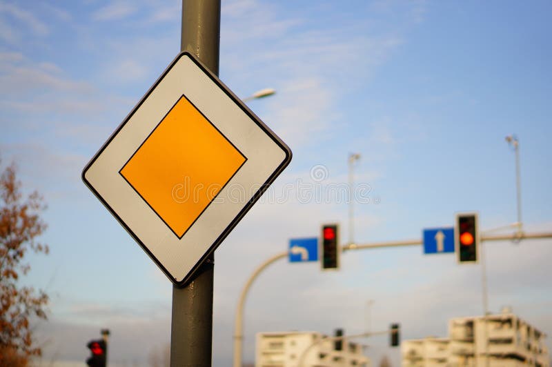 Closeup Shot of a Road Sign on a Column Indicating the Priority for the ...