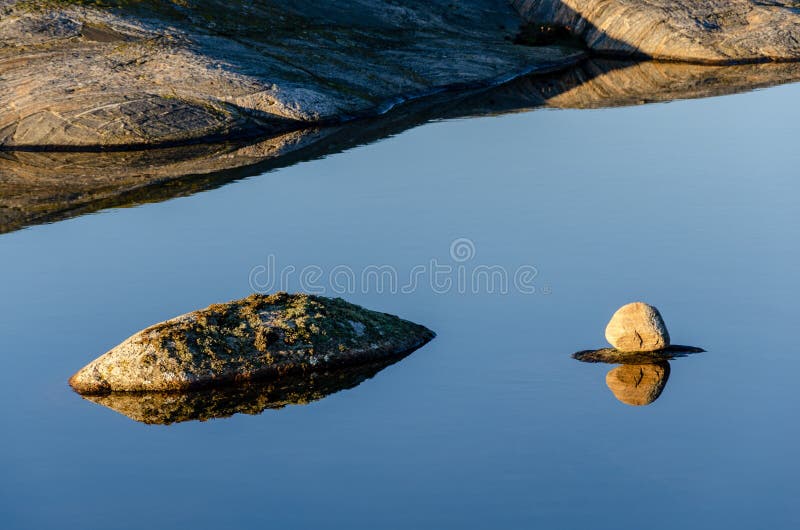 Closeup Shot of the Rocks in the Pure Blue Transparent Water of the ...