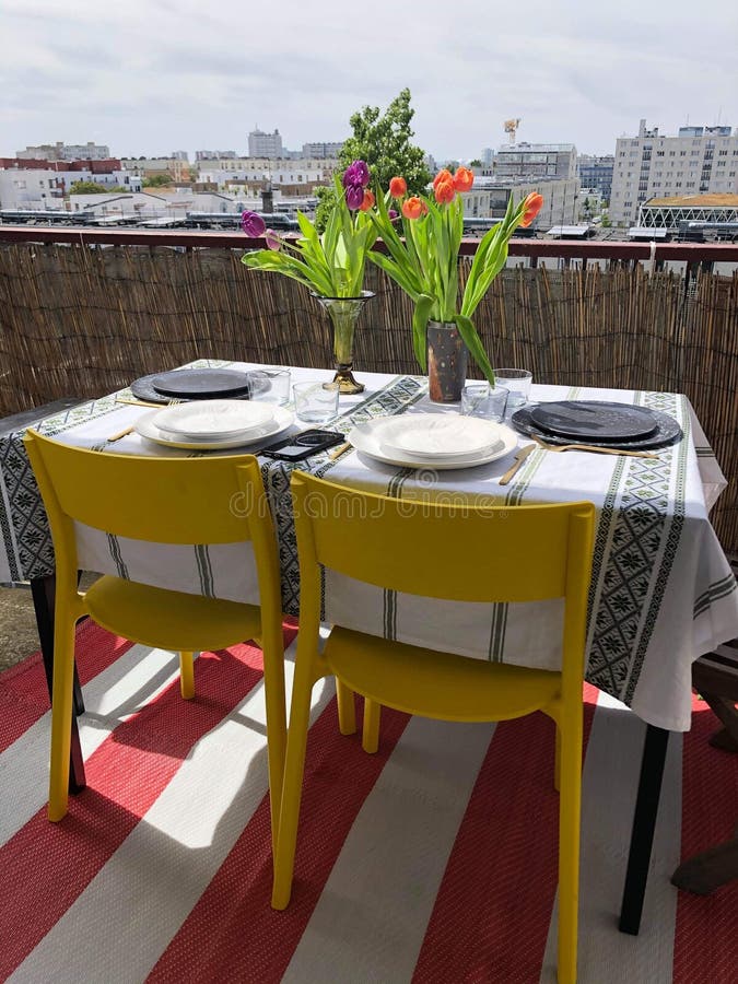 Closeup Shot of Rooftop Cafe Table Set Up with Tulips Stock Image ...