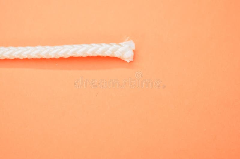 Closeup Shot of a Rope End Isolated on a Peach Color Background Stock ...