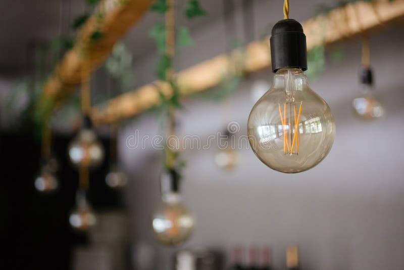 Closeup Shot of a Round Light Bulb Hanging in the Restaurant Stock ...