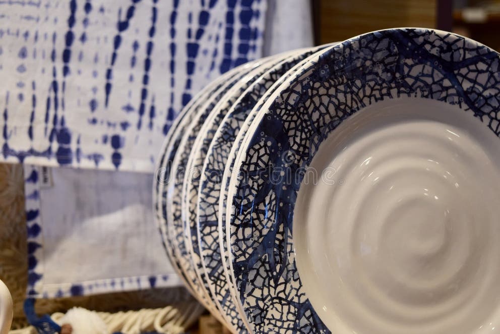 Closeup Shot of a Row of White Dinner Plates with Blue Patterned ...