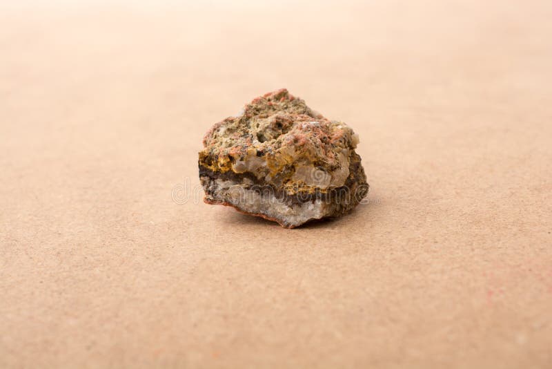 Closeup Shot of a Small Piece of Igneous Rock Isolated on Smooth Pink ...
