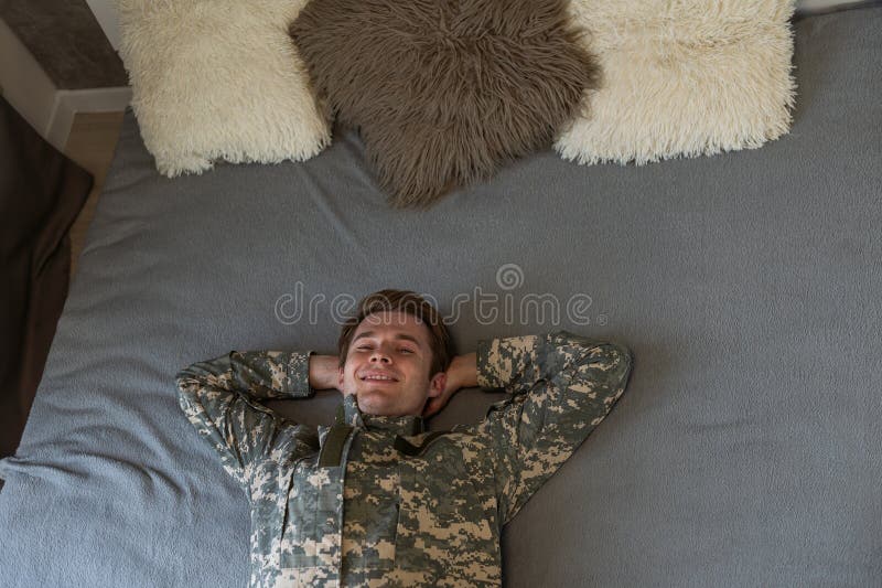 A Closeup Shot of a Soldier Sleeping in Bed. Stock Image - Image of ...