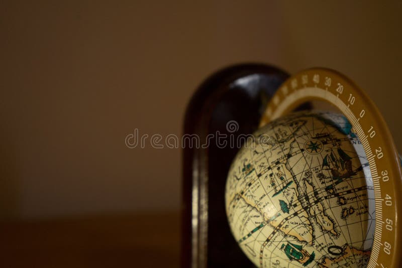 Closeup Shot of a Spinning Globe on a Beige Background Stock Photo ...